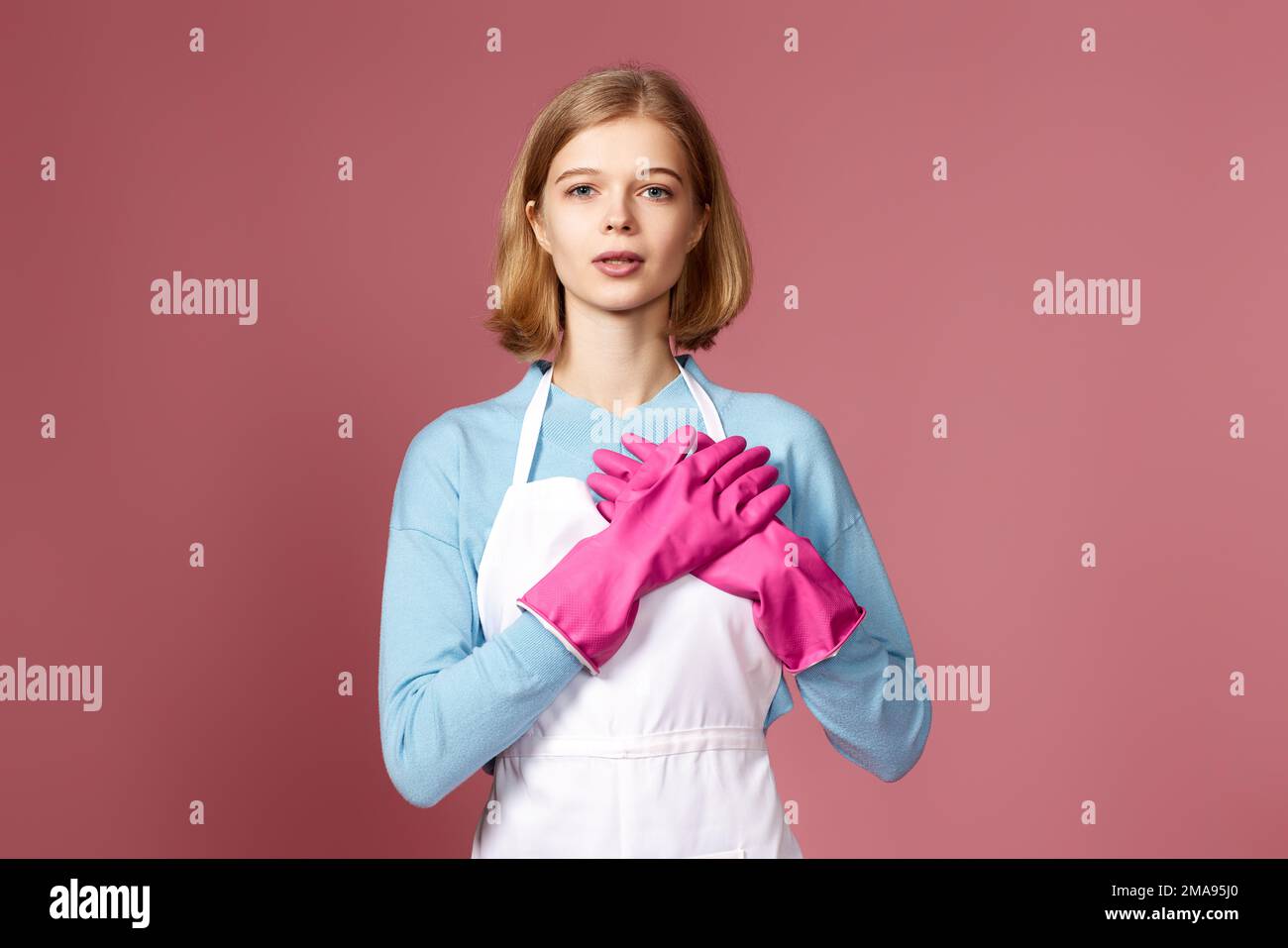 woman in rubber gloves with hands on chest with closed eyes Stock Photo ...