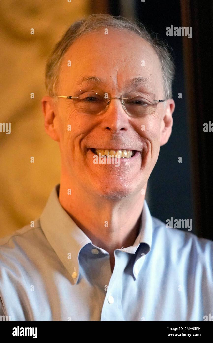 Douglas W. Diamond poses for photographers in the lobby of his ...