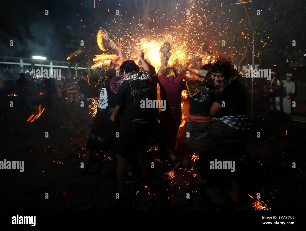 Men lash each other with burning coconut husks during the annual ...