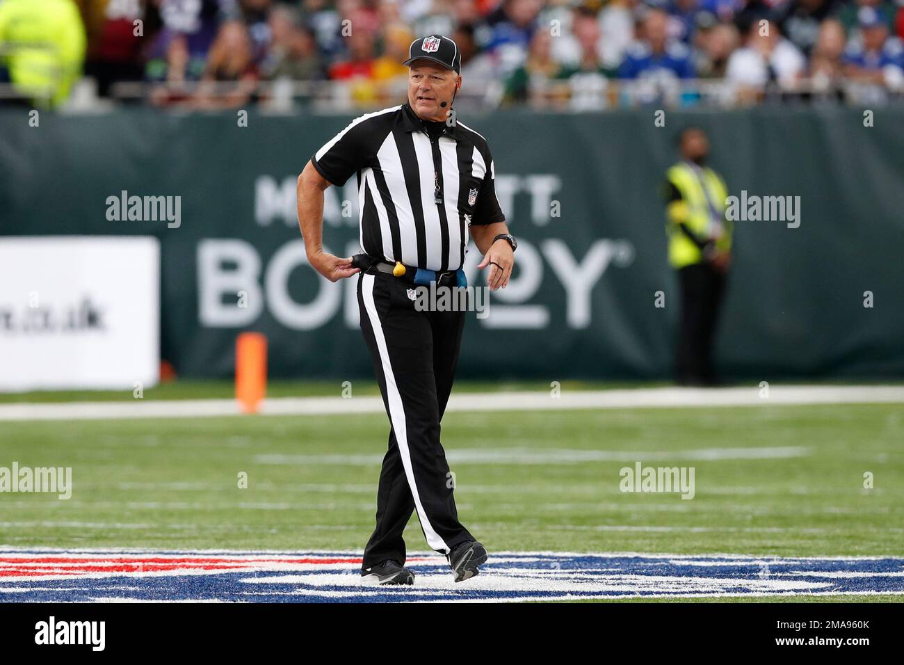 Back judge Scott Helverson (93) works during an NFL football game ...