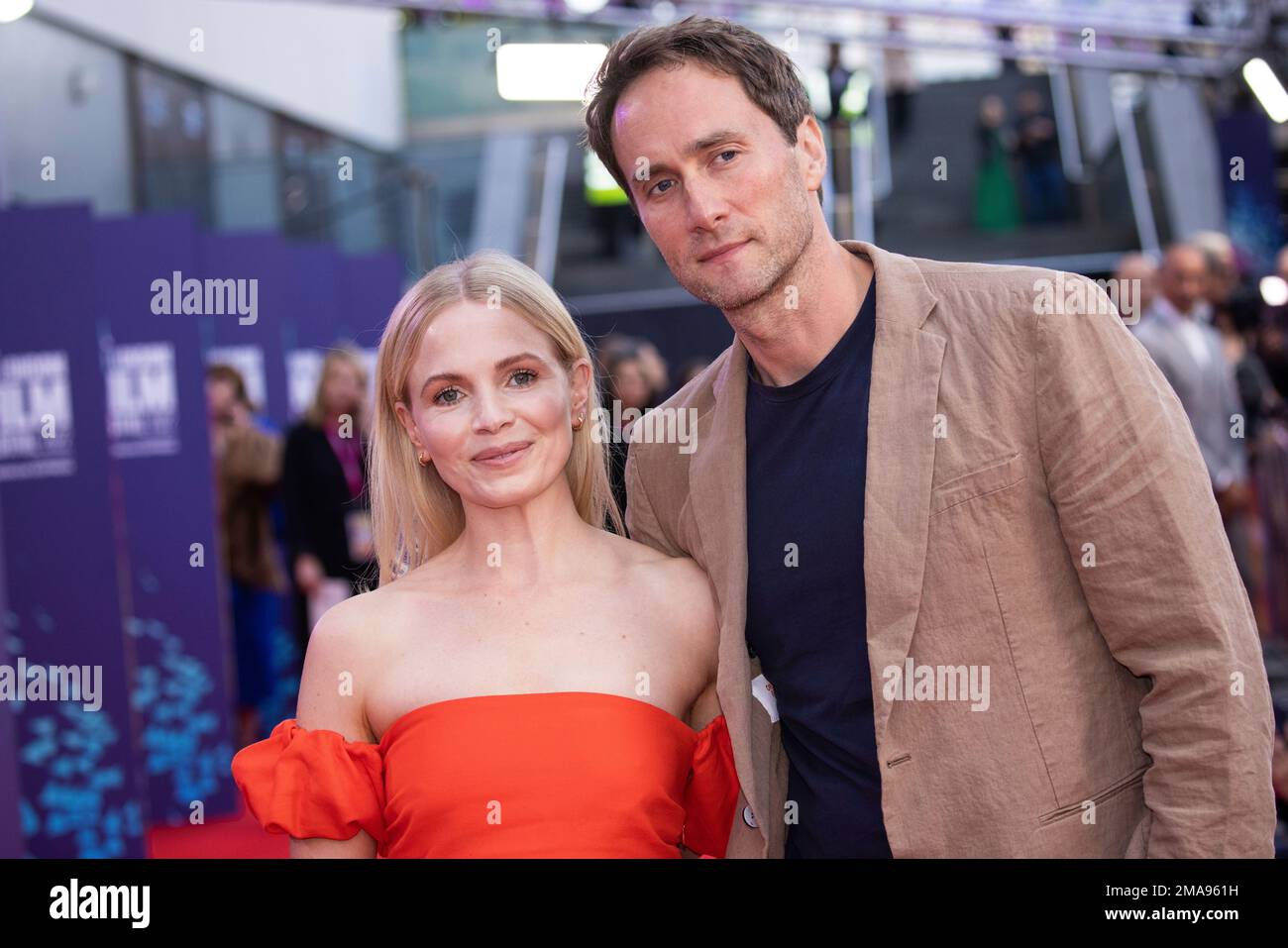 Kate Phillips and Oliver Chris pose for photographers upon arrival for the premiere of the film ...