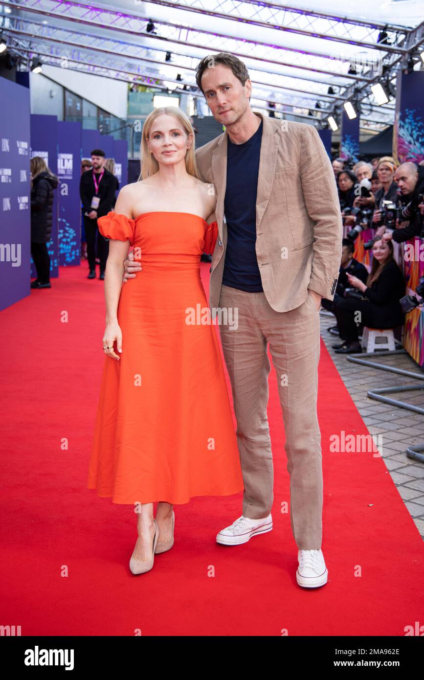 Kate Phillips and Oliver Chris pose for photographers upon arrival for ...