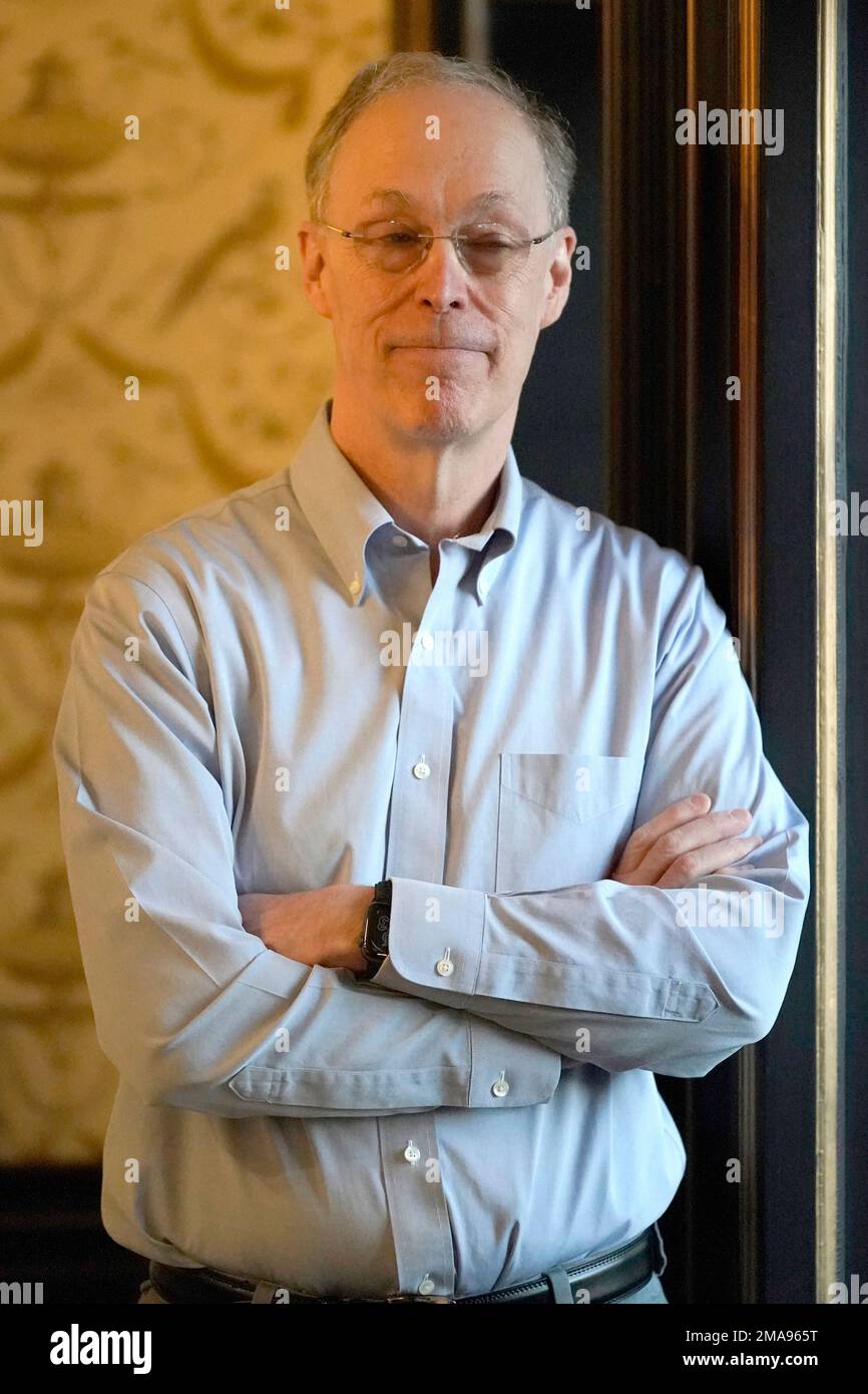 Douglas W. Diamond poses for photographers in the lobby of his ...