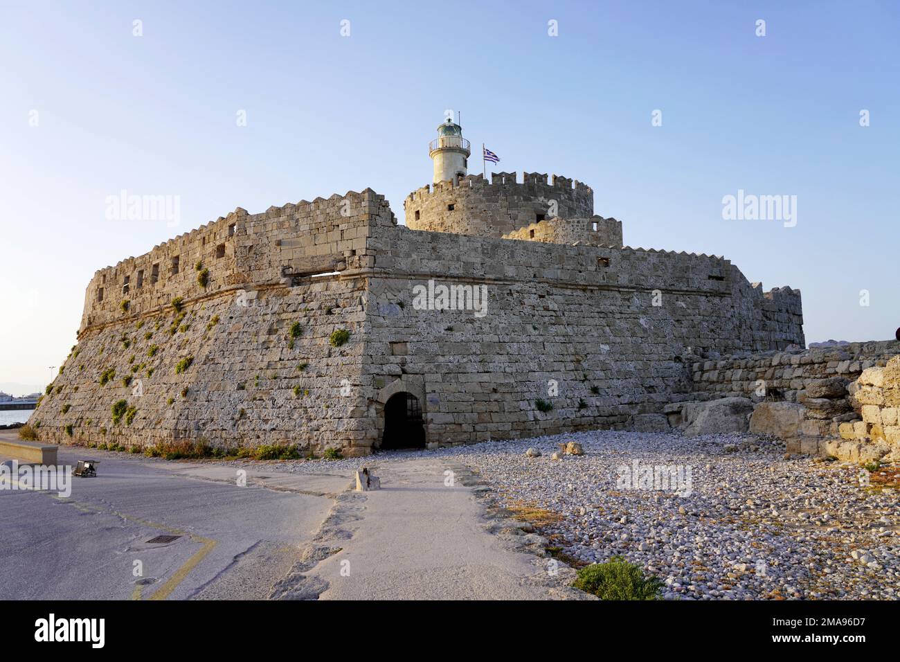 Sunset on Tower and Fort of Saint Nicholas, Rhodes, Greece Stock Photo ...