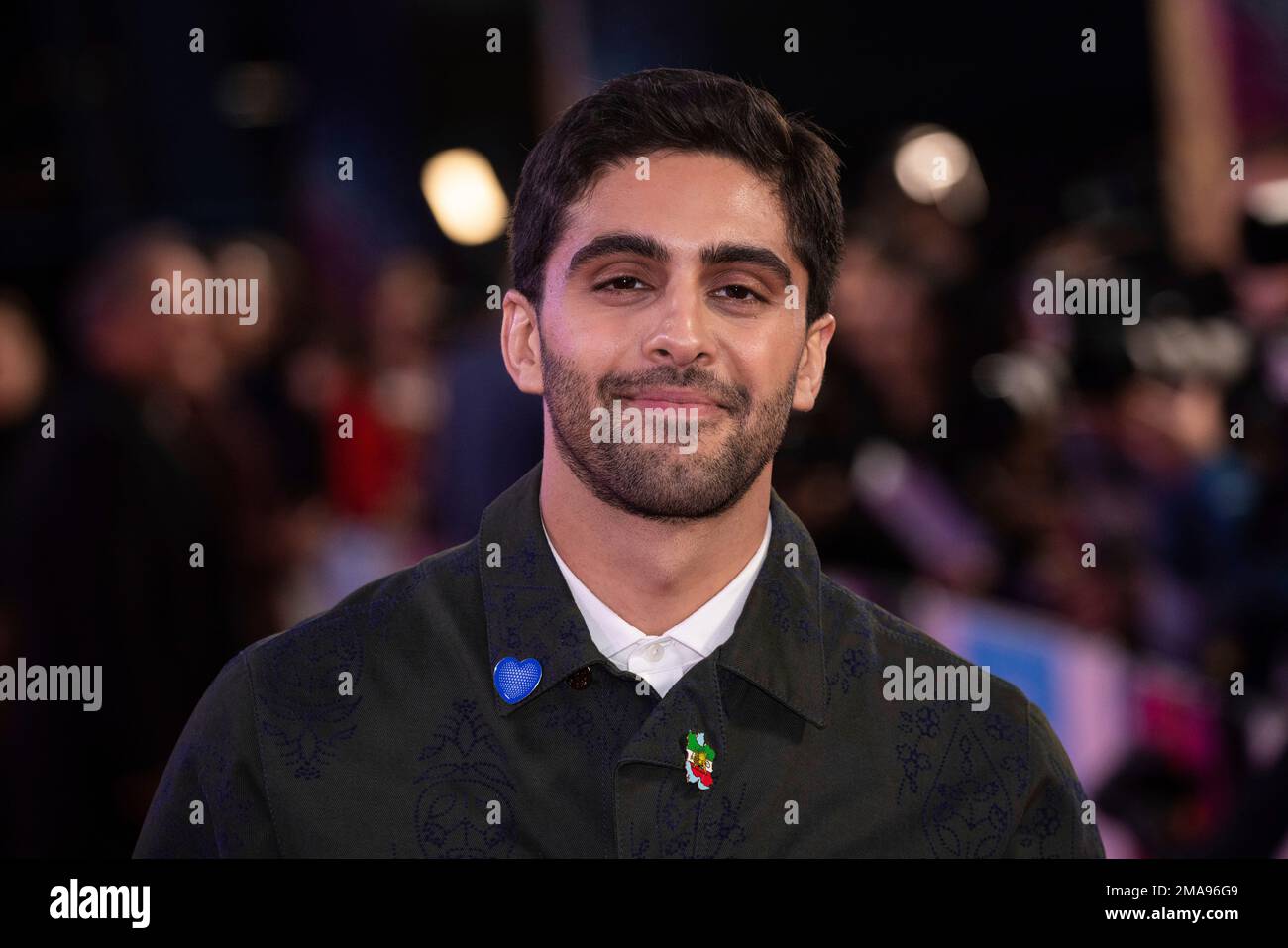 Arian Nik poses for photographers upon arrival for the premiere of the ...