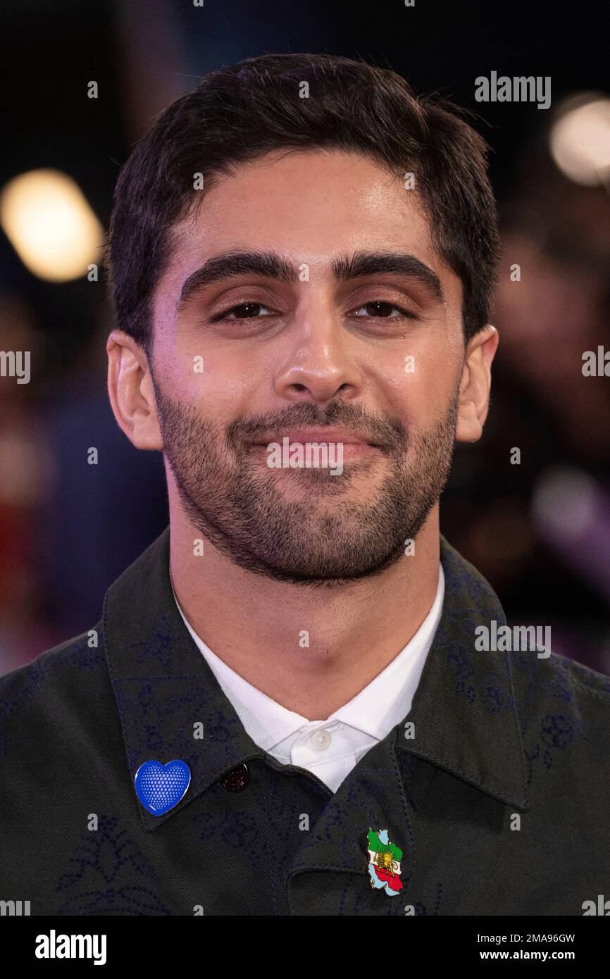 Arian Nik poses for photographers upon arrival for the premiere of the ...