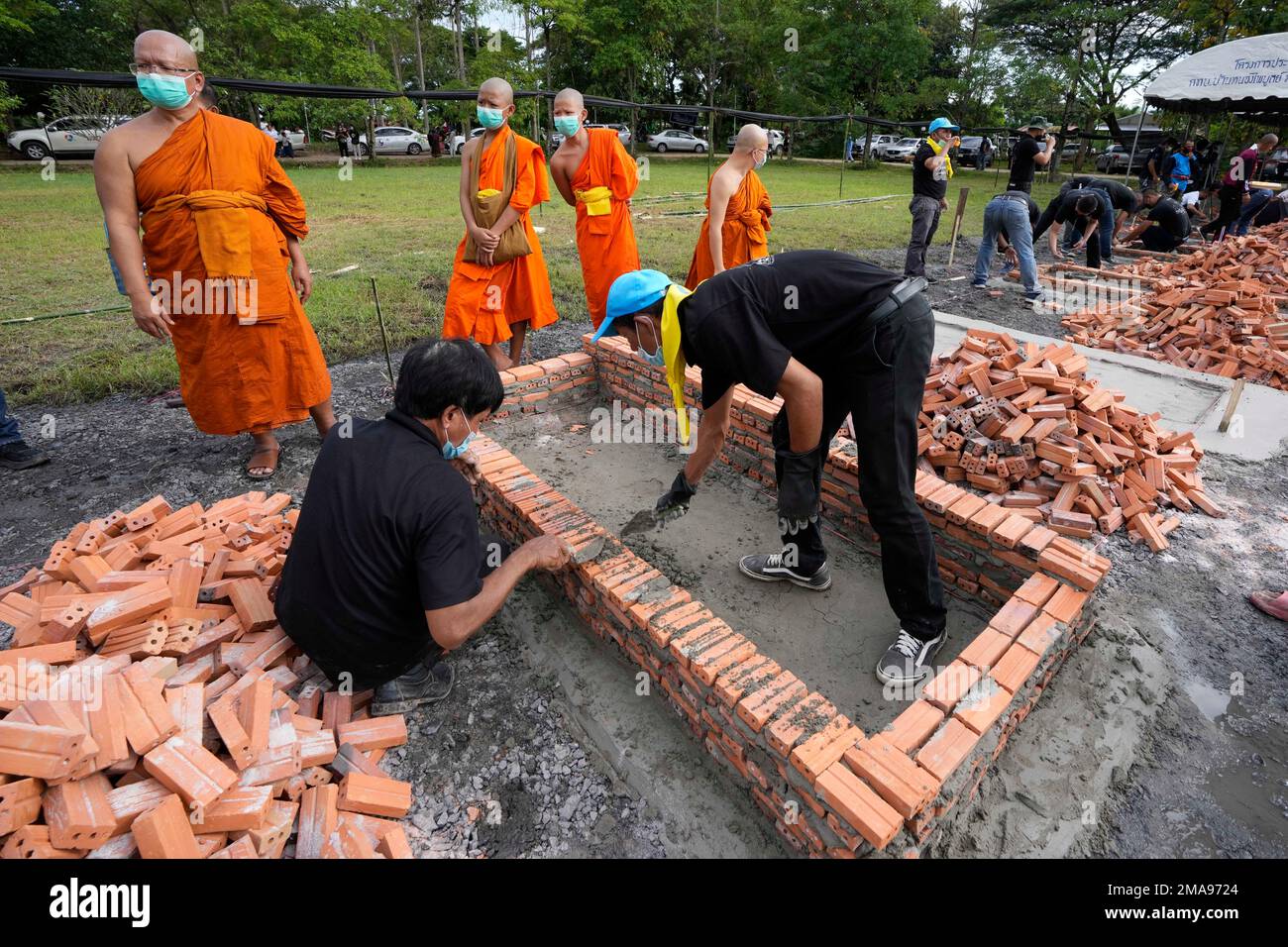 Buddhist monks oversee the making of cremation furnaces at Wat Rat ...