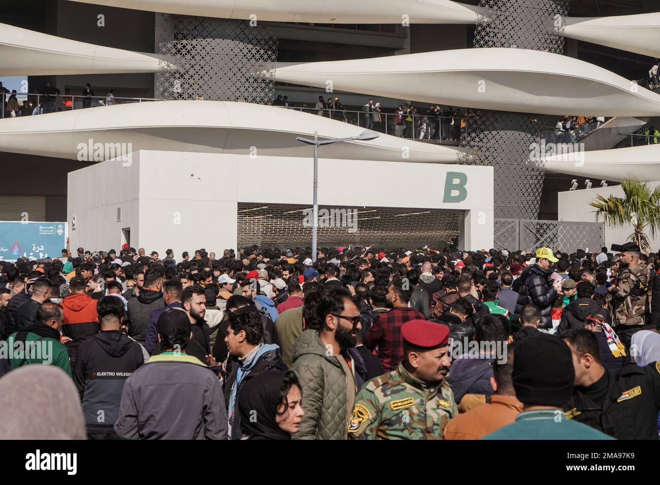 Basrah, Iraq. 19th Jan, 2023. Football fans crowd in front of the Jaza ...