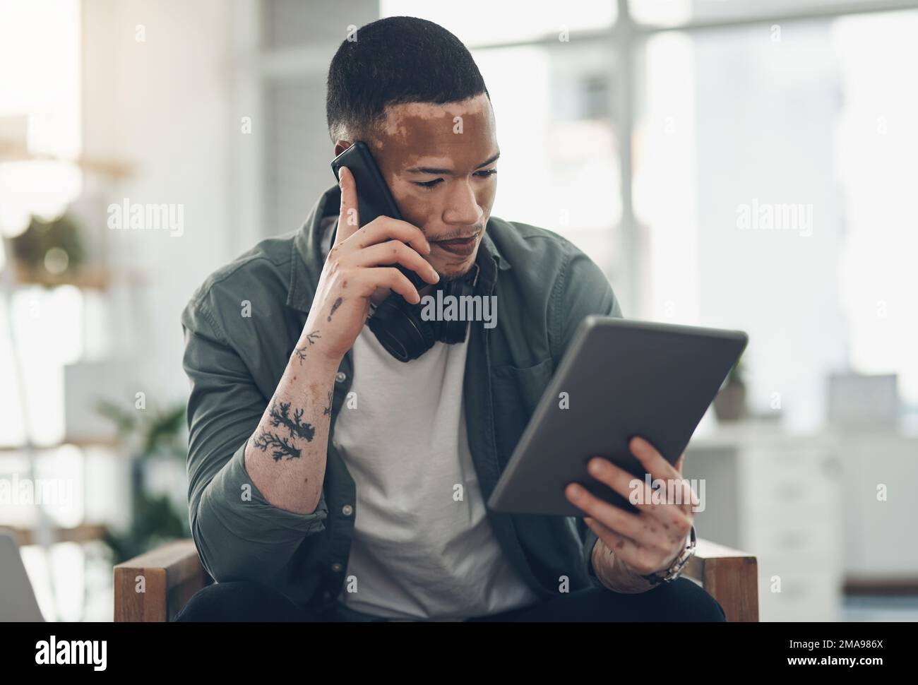 Success is not the key to happiness. a young business man on a phone ...