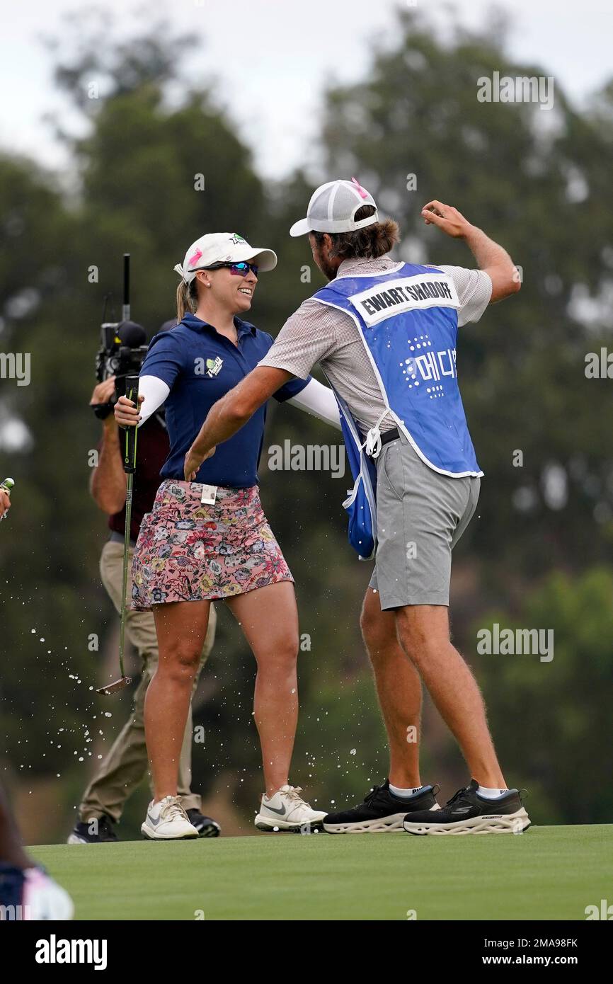 Jodi Ewart Shadoff, second from left, of England, hugs her caddie John ...
