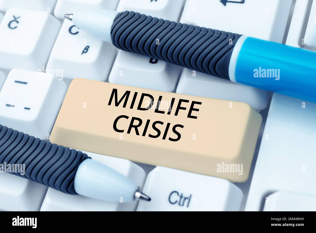 Hand writing sign Midlife Crisis. Word Written on Software development ...