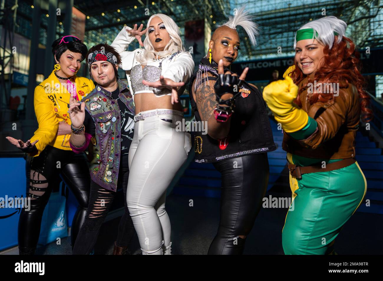 Attendees dressed as characters from "X-Men" pose during New York Comic ...
