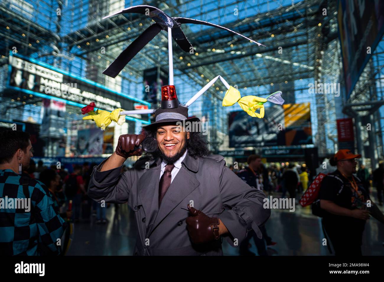 An attendee dressed as Inspector Gadget poses during New York Comic Con ...