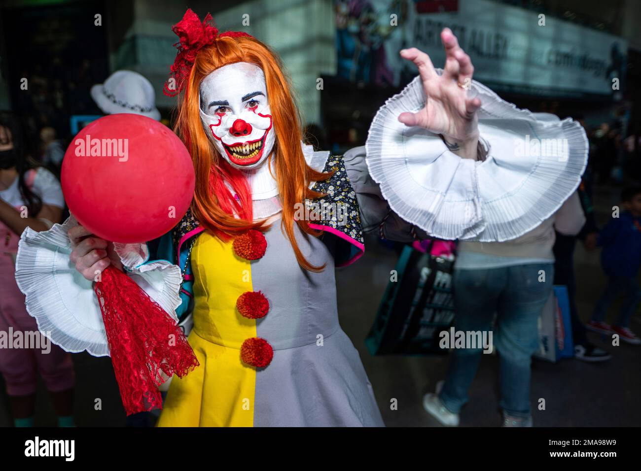 An attendee dressed as Pennywise poses during New York Comic Con at the ...
