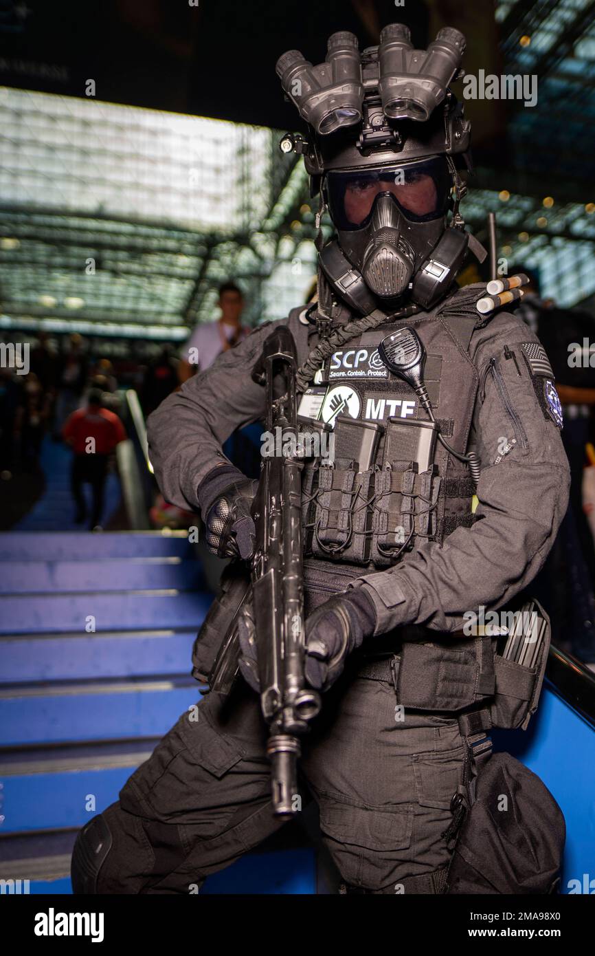 An attendee dressed as a character from the SCP Foundation poses during ...