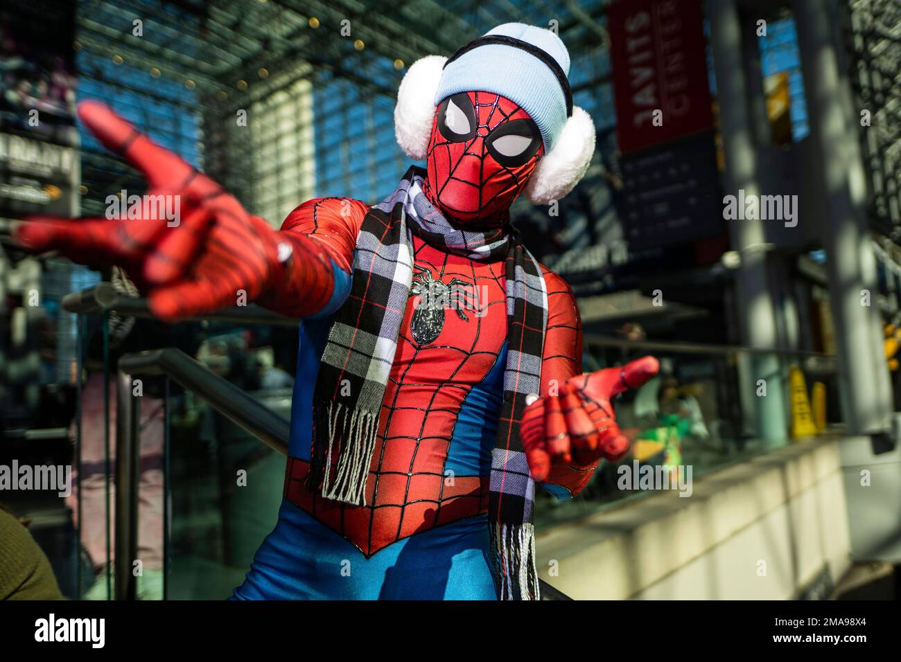 An attendee dressed as Spider-Man poses during New York Comic Con at ...