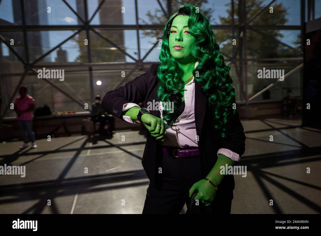 An attendee dressed as She-Hulk poses during New York Comic Con at the ...