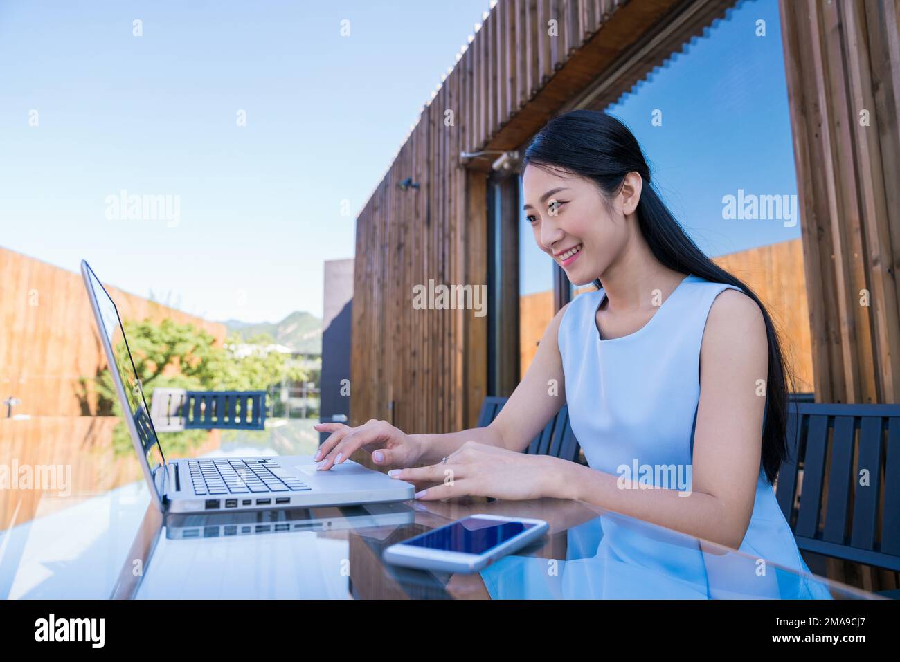 A young woman use the computer Stock Photo - Alamy