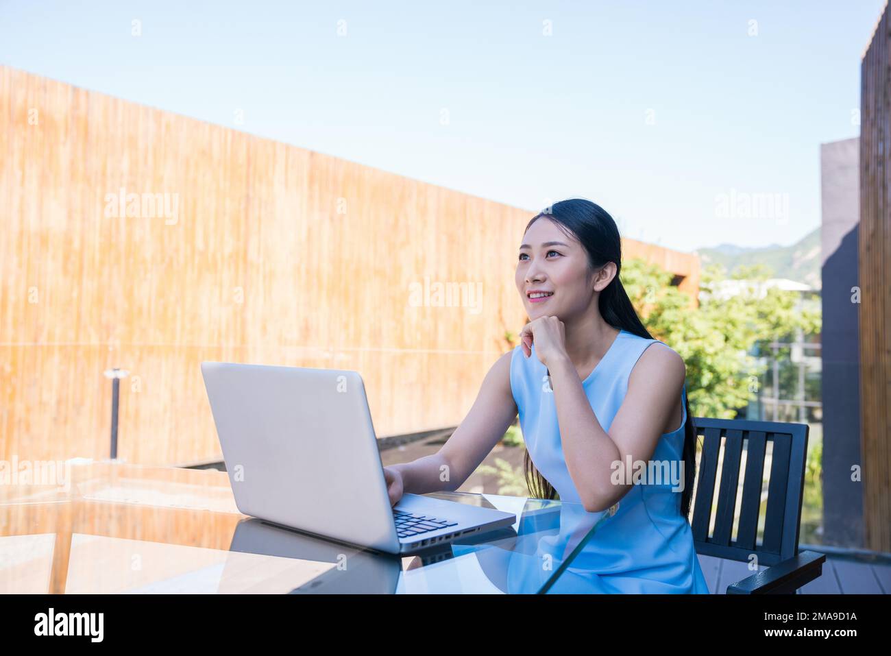 A young woman use the computer Stock Photo - Alamy