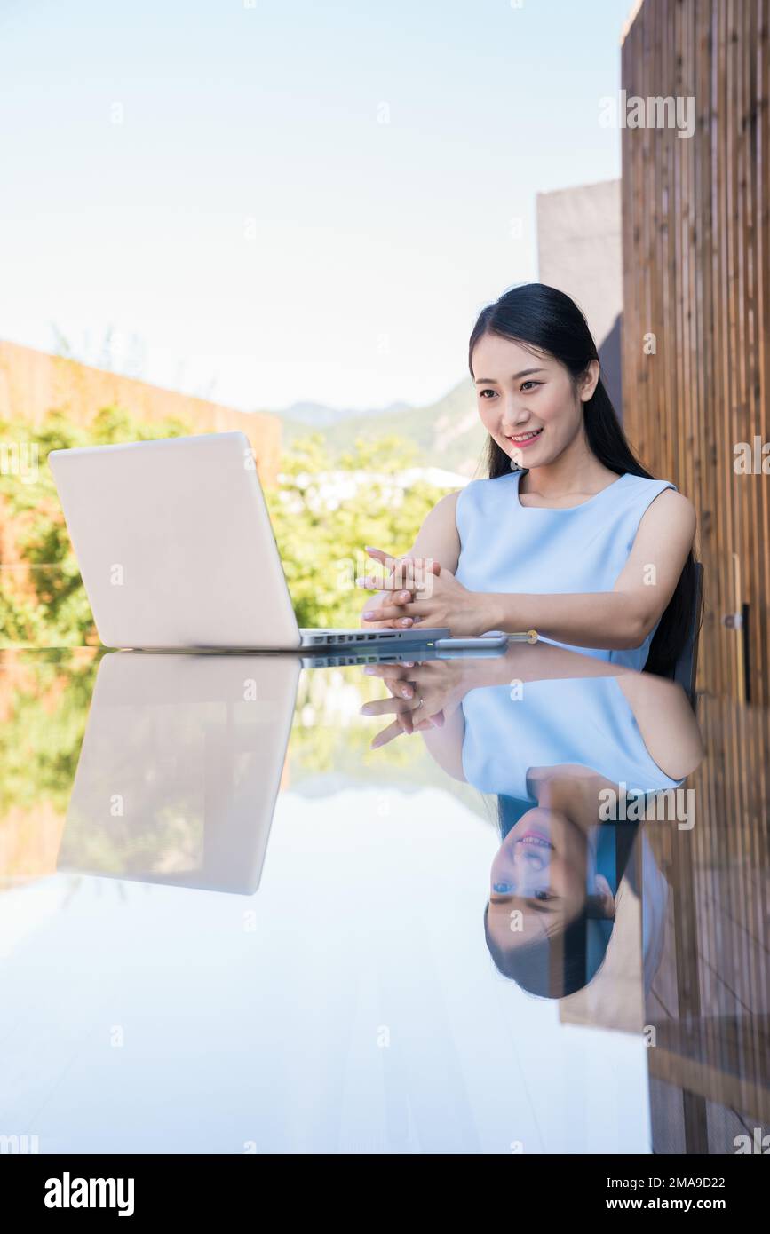 A young woman use the computer Stock Photo - Alamy