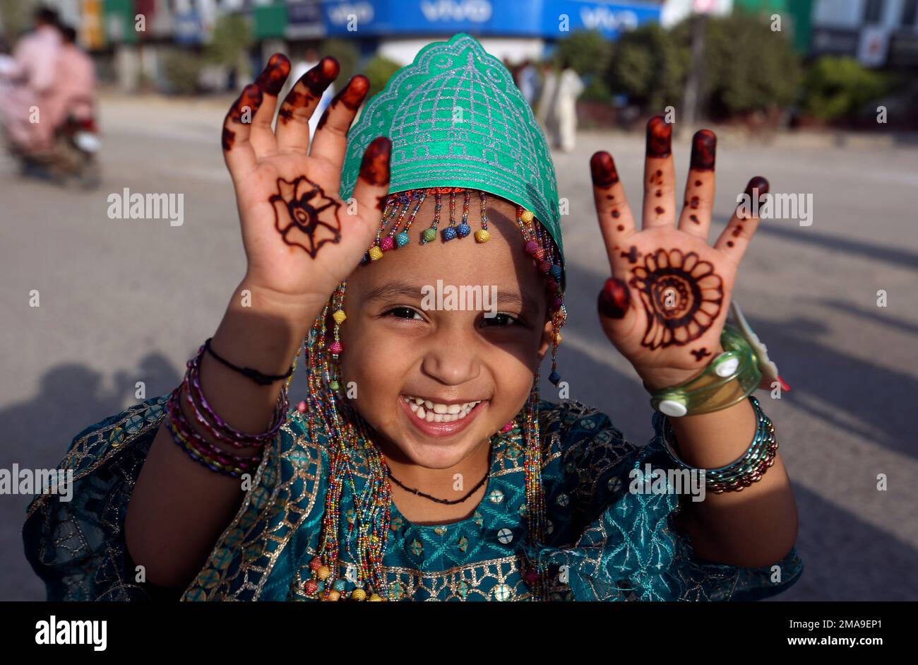 A Muslim girl poses for a photograph as she celebrates Mawlid al-Nabi ...