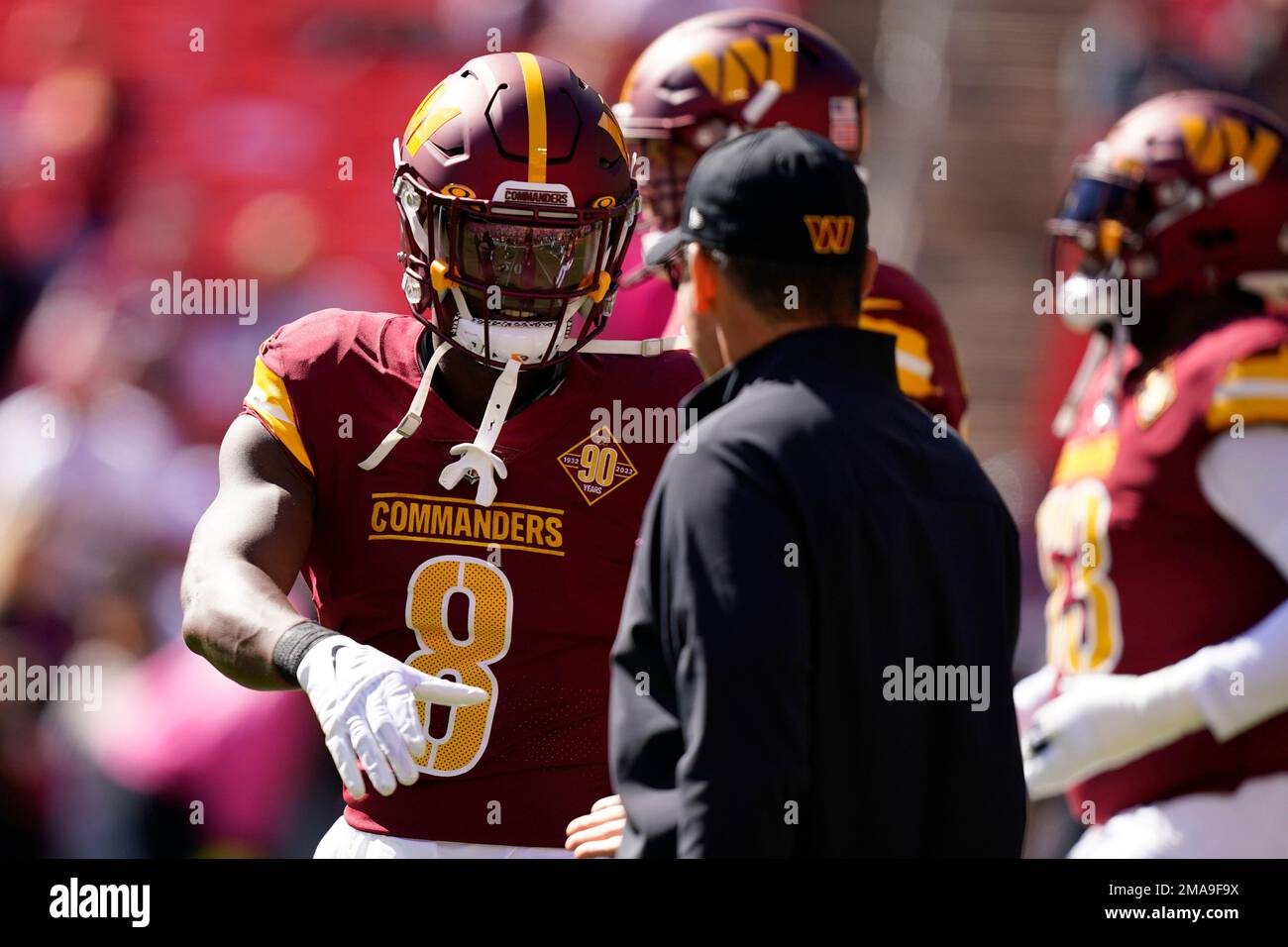 Washington Commanders running back Brian Robinson Jr., left, speaks ...