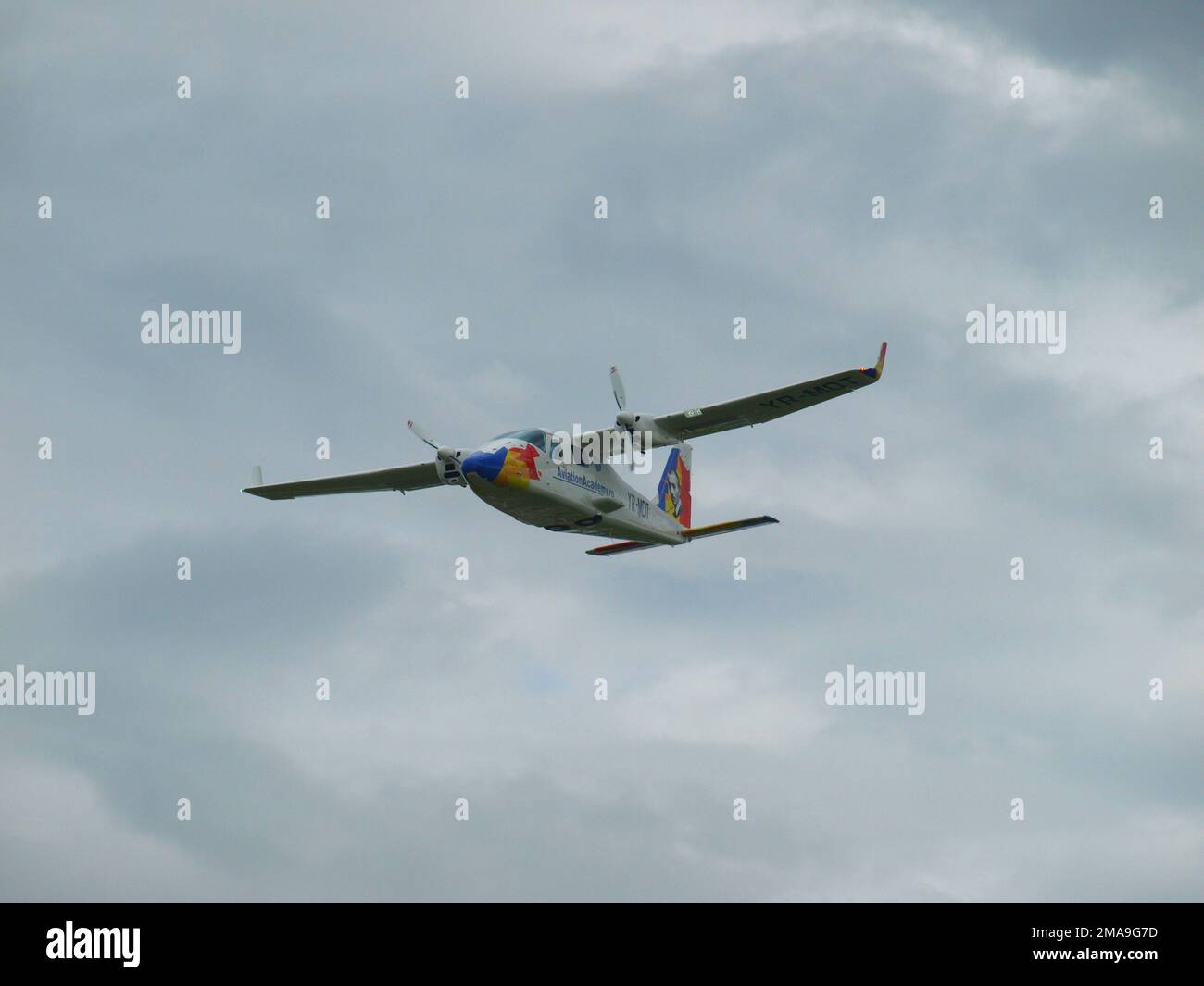 Light aircraft performing acrobatic aerobatic flying during air show ...