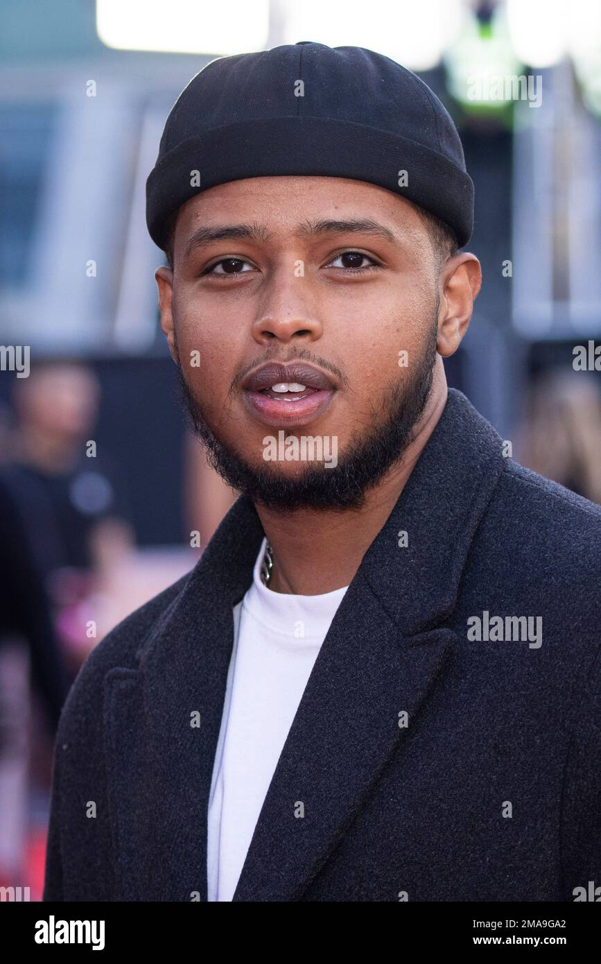 Elmi Rashid Elmi poses for photographers upon arrival for the premiere ...