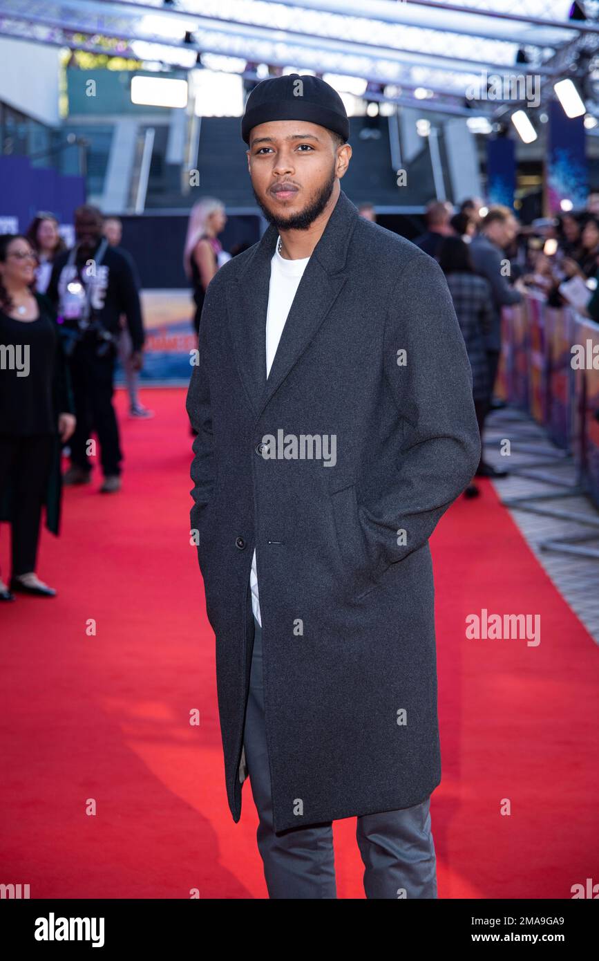 Elmi Rashid Elmi poses for photographers upon arrival for the premiere ...