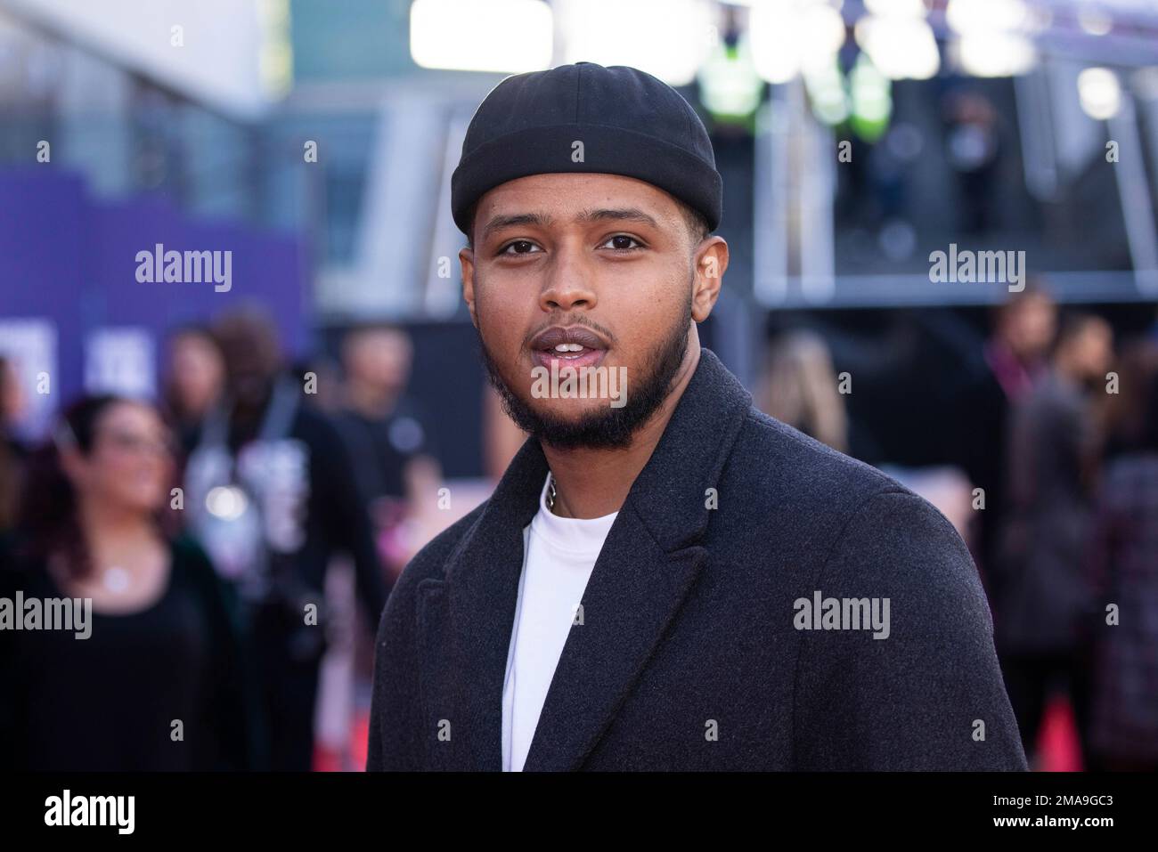 Elmi Rashid Elmi poses for photographers upon arrival for the premiere ...