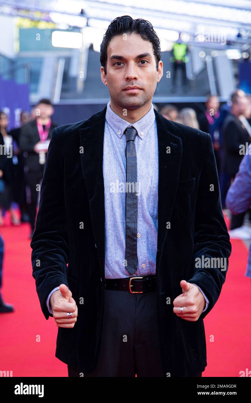 James Krishna Floyd poses for photographers upon arrival for the ...