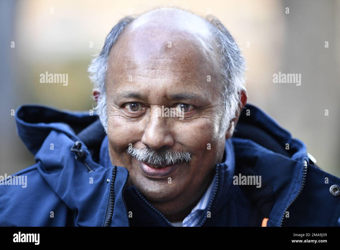 Ananga Moonesinghe, who lives with dementia, delivers a petition letter ...