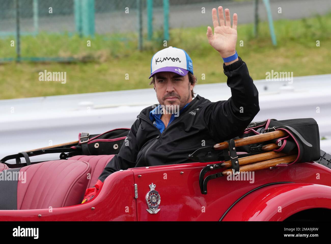 Alpine driver Fernando Alonso of Spain waves during the drivers parade ...