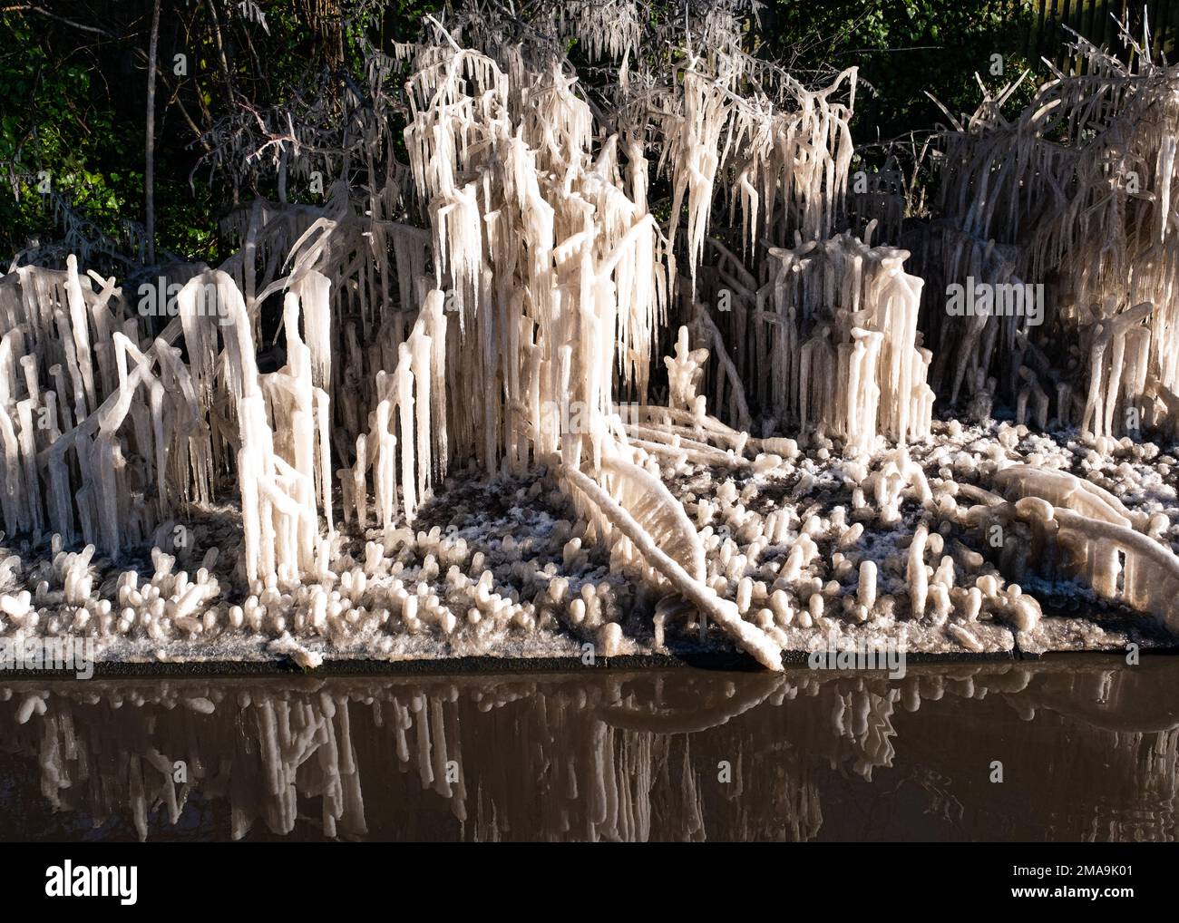 Ice sculpture and icicles where passing vehicles splash on a freezing ...
