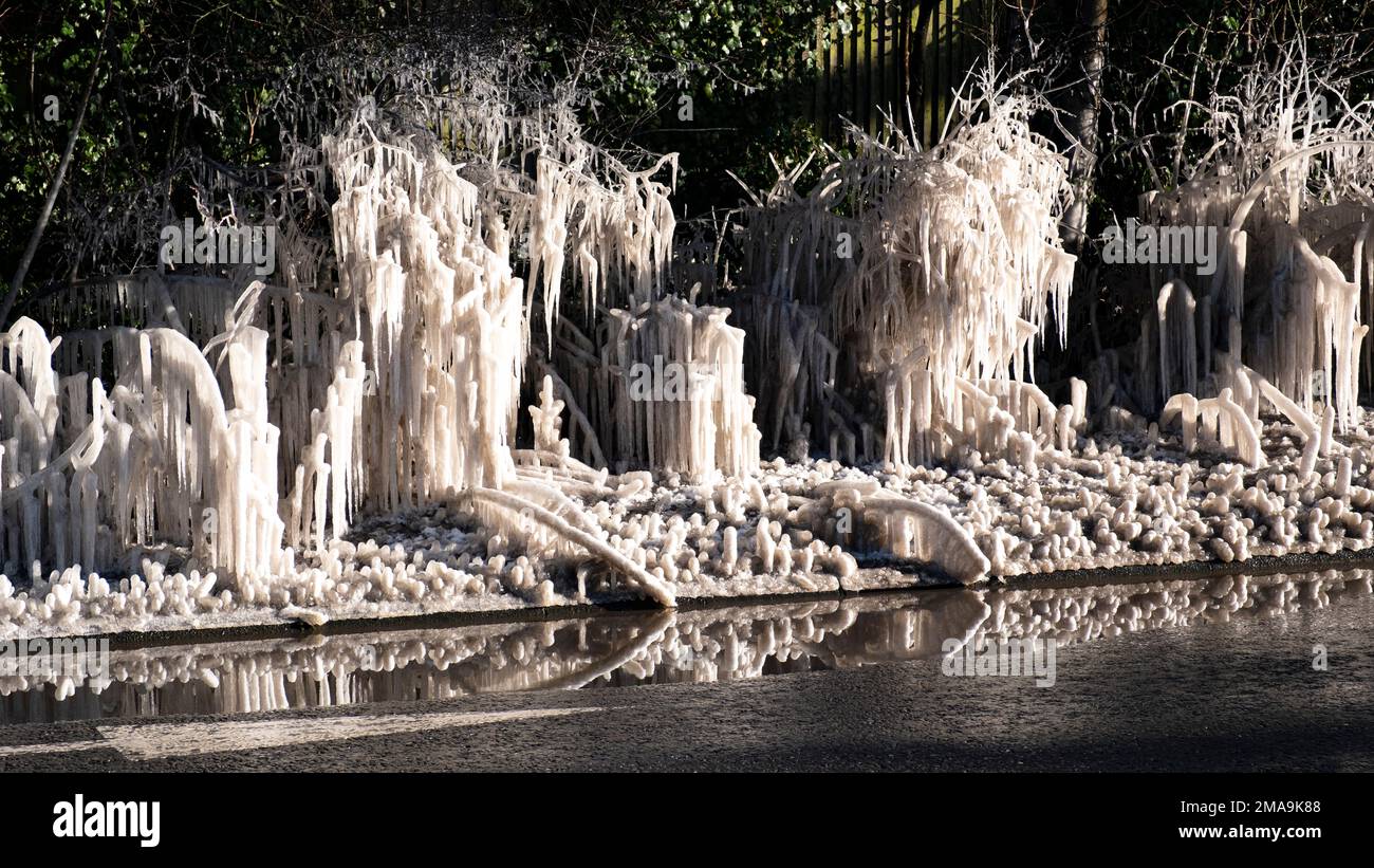 Ice sculpture and icicles where passing vehicles splash on a freezing ...