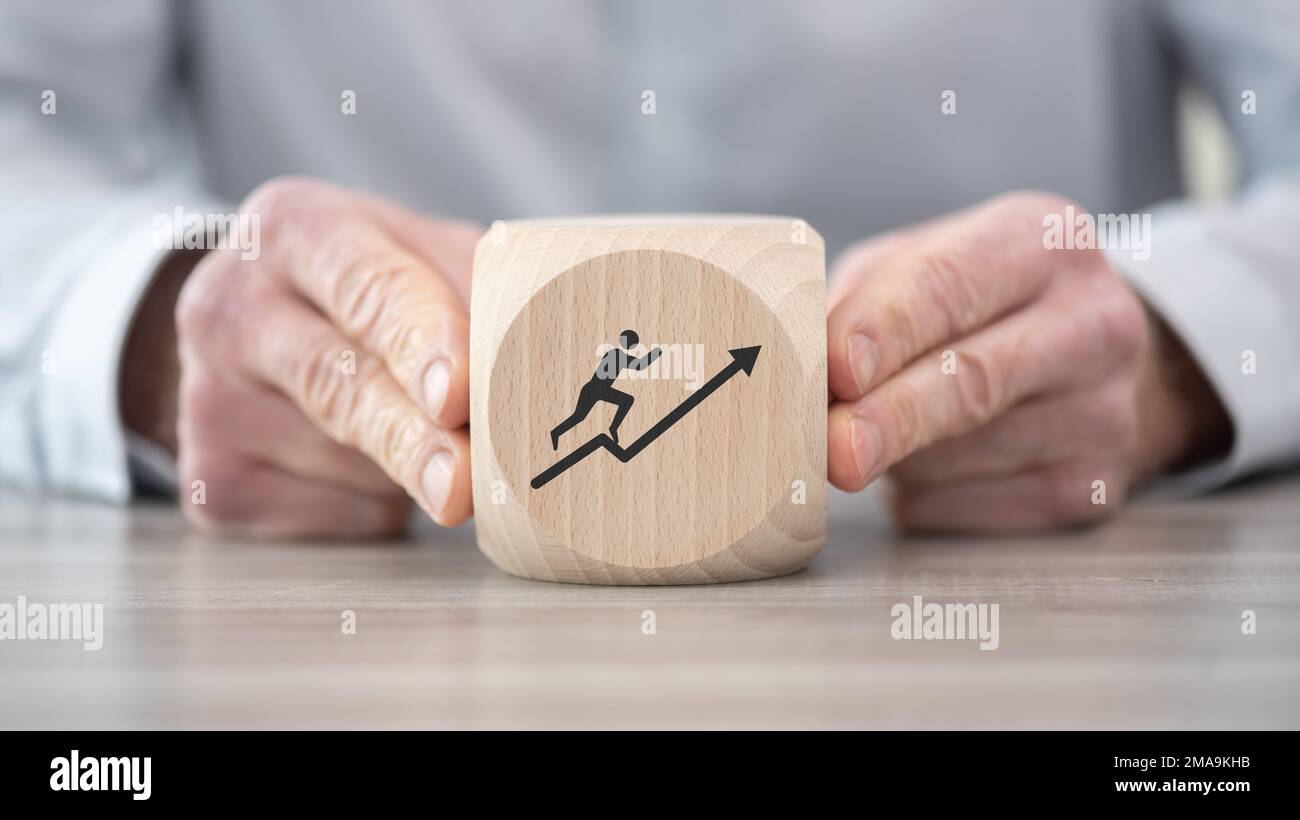 Wooden block with symbol of motivation concept Stock Photo - Alamy