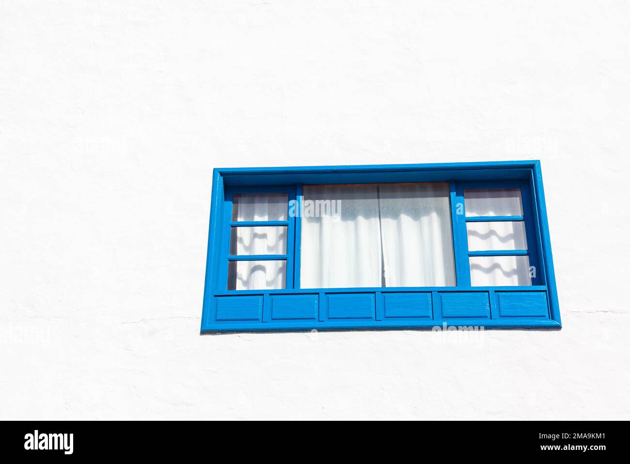 Blue window at white wall . Wooden window with white curtains Stock ...