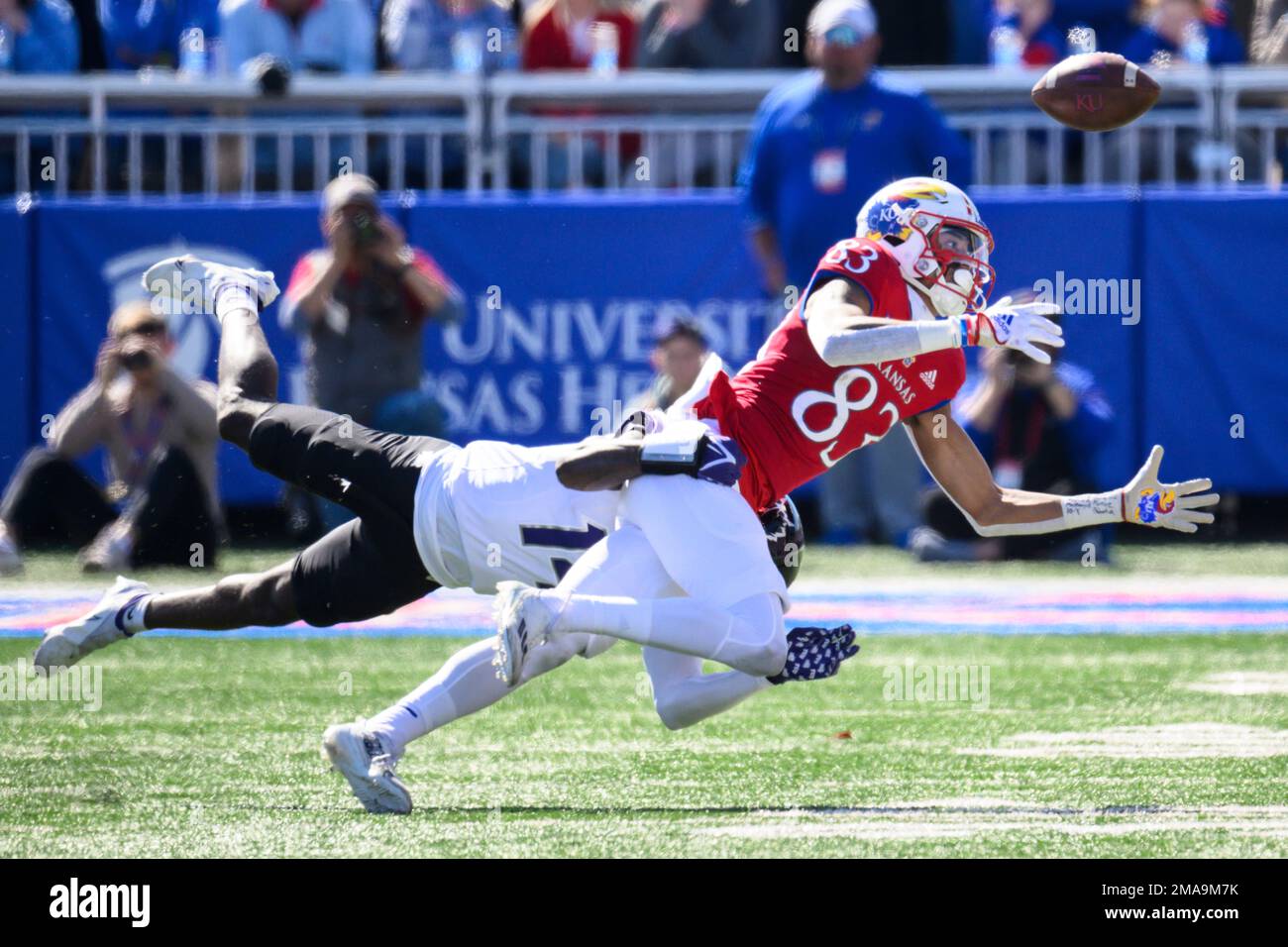 TCU safety Abraham Camara (14) breaks up a pass to Kansas wide receiver ...
