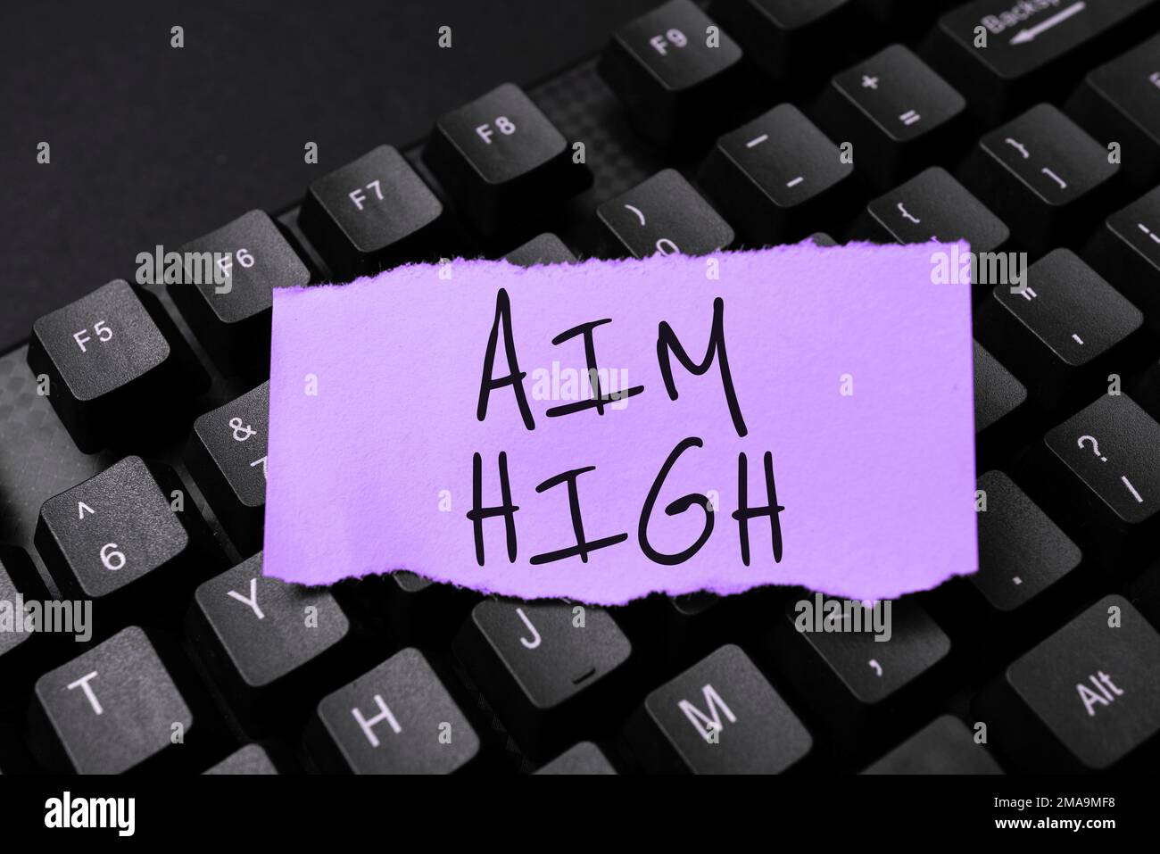 Hand writing sign Aim High. Word for go for best job school or activity ...