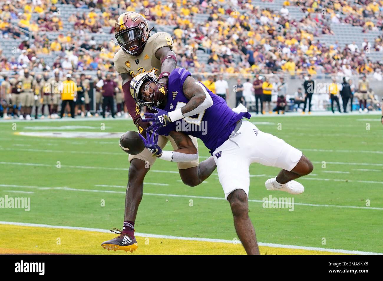 Arizona State's defensive back Ro Torrence, left, breaks up a pass ...