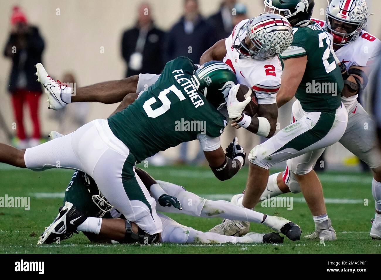 Ohio State wide receiver Emeka Egbuka (2) is tackled by Michigan State ...