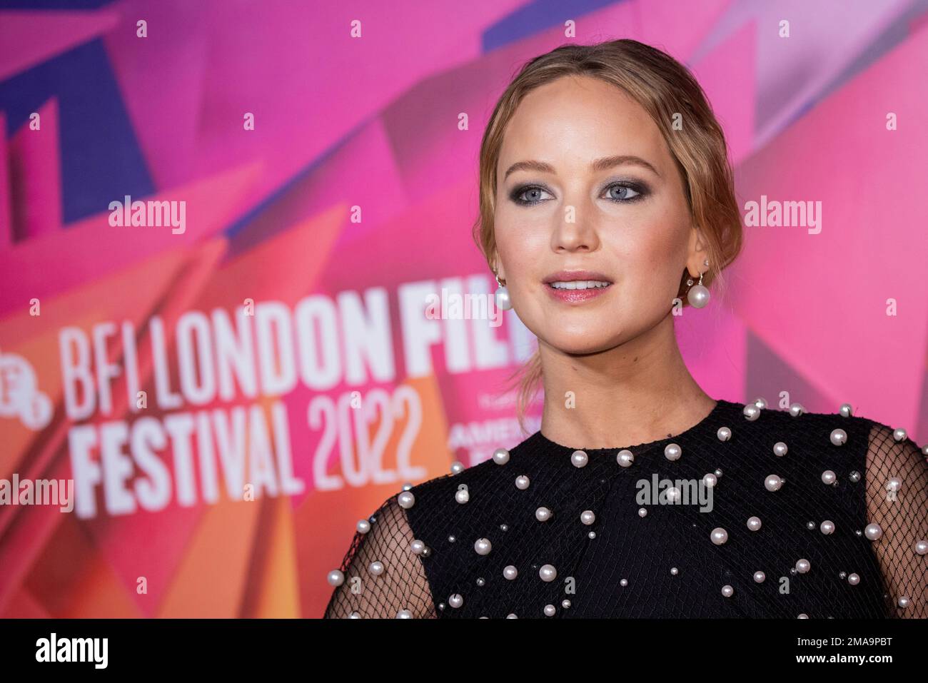 Jennifer Lawrence poses for photographers upon arrival for the premiere ...