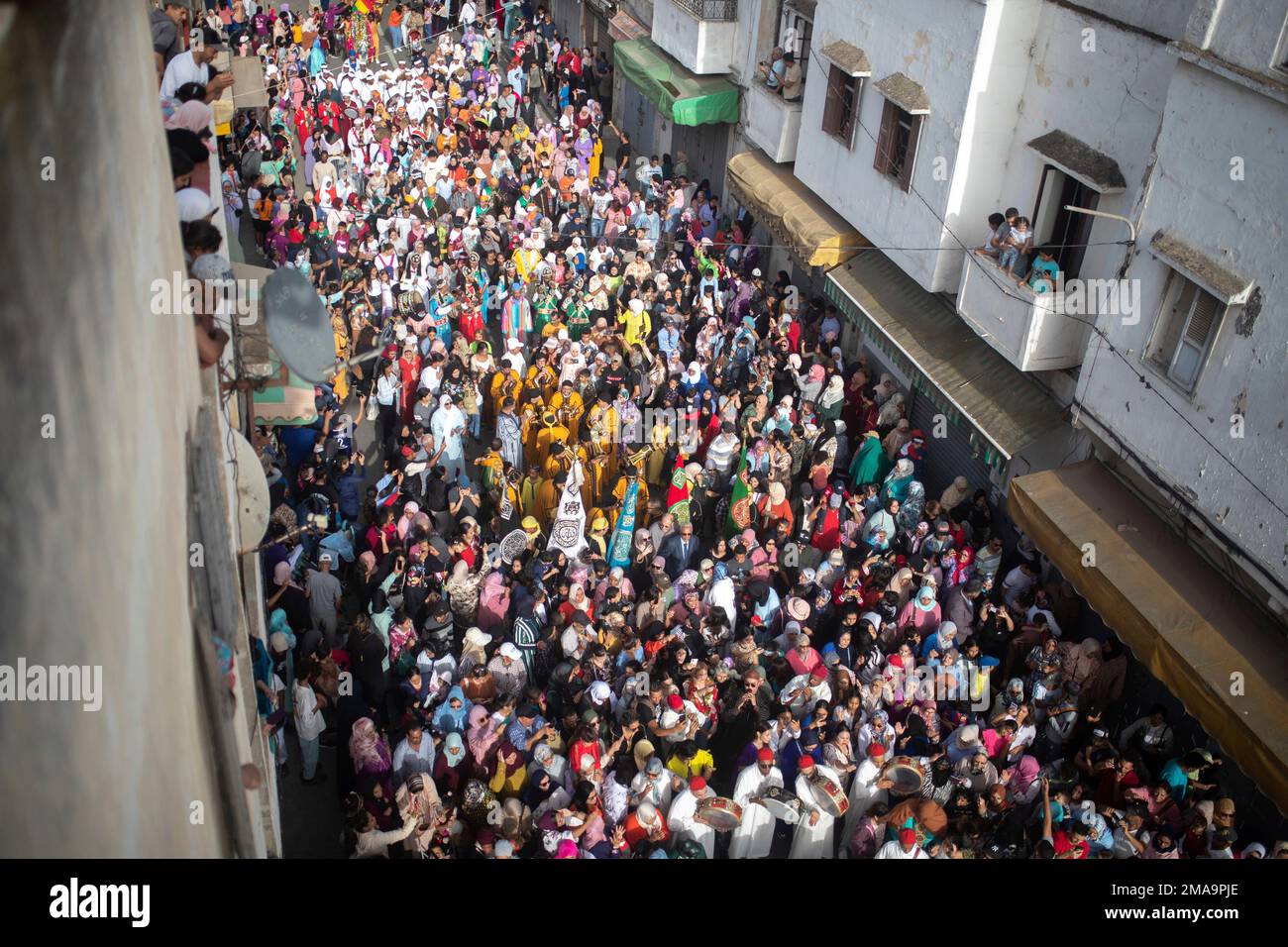 People take part in a parade celebrating the birthday of Prophet ...