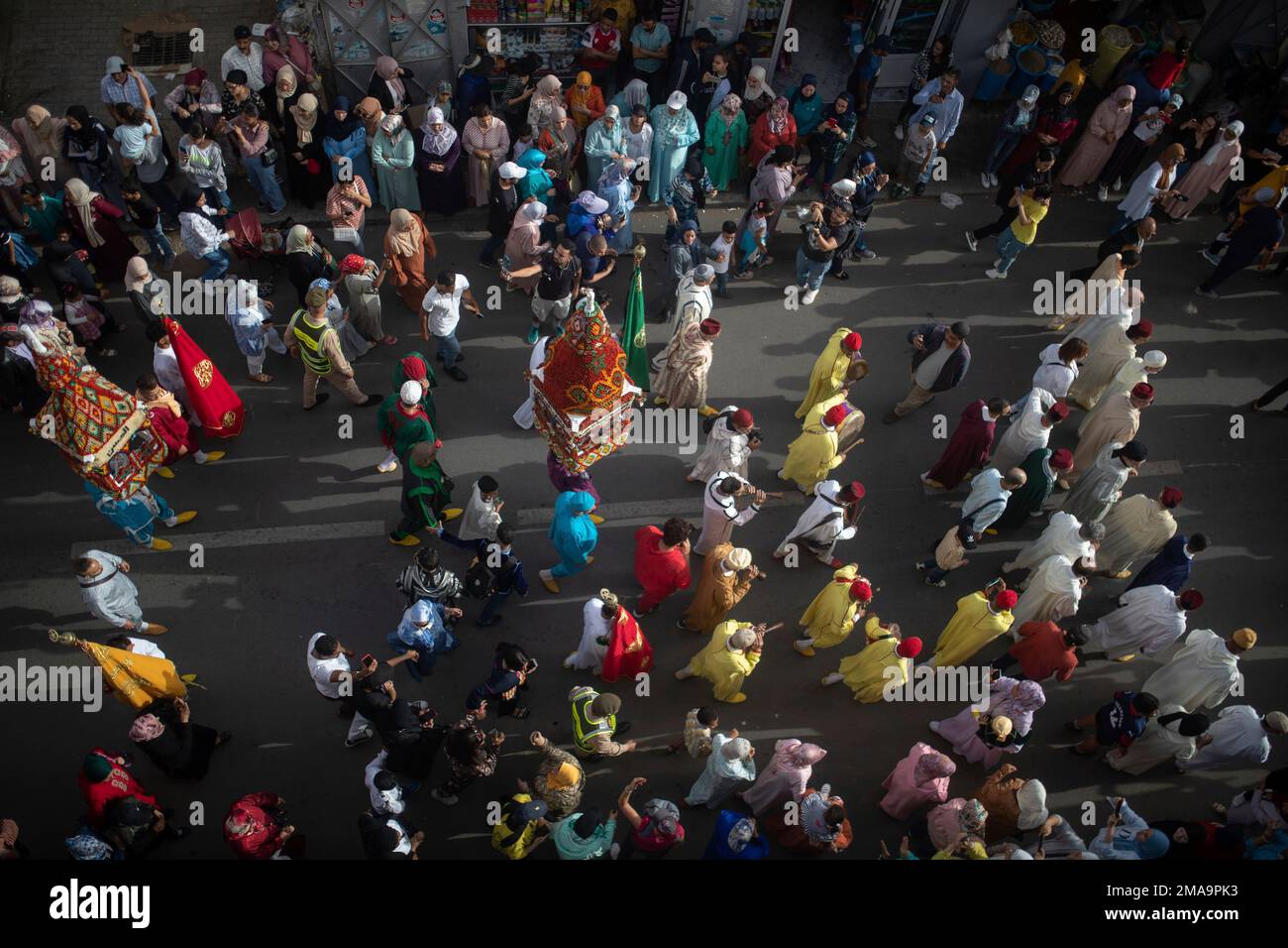 People take part in a parade celebrating the birthday of Prophet ...