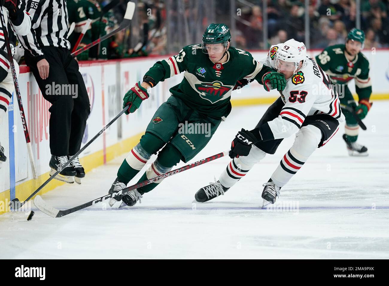Minnesota Wild center Marco Rossi (23) and Chicago Blackhawks right ...