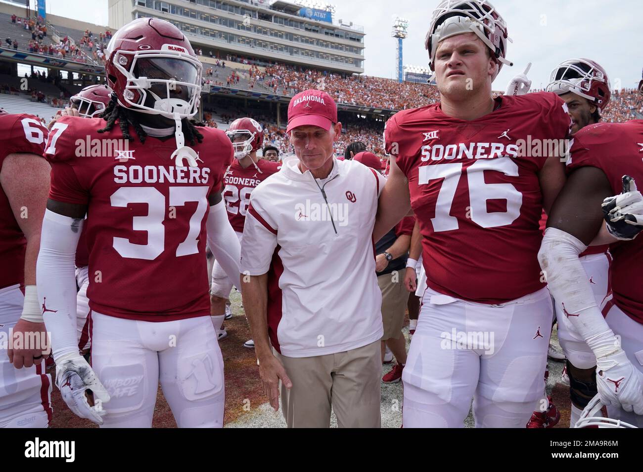 Oklahoma head coach Brent Venables, center, leaves the field with ...