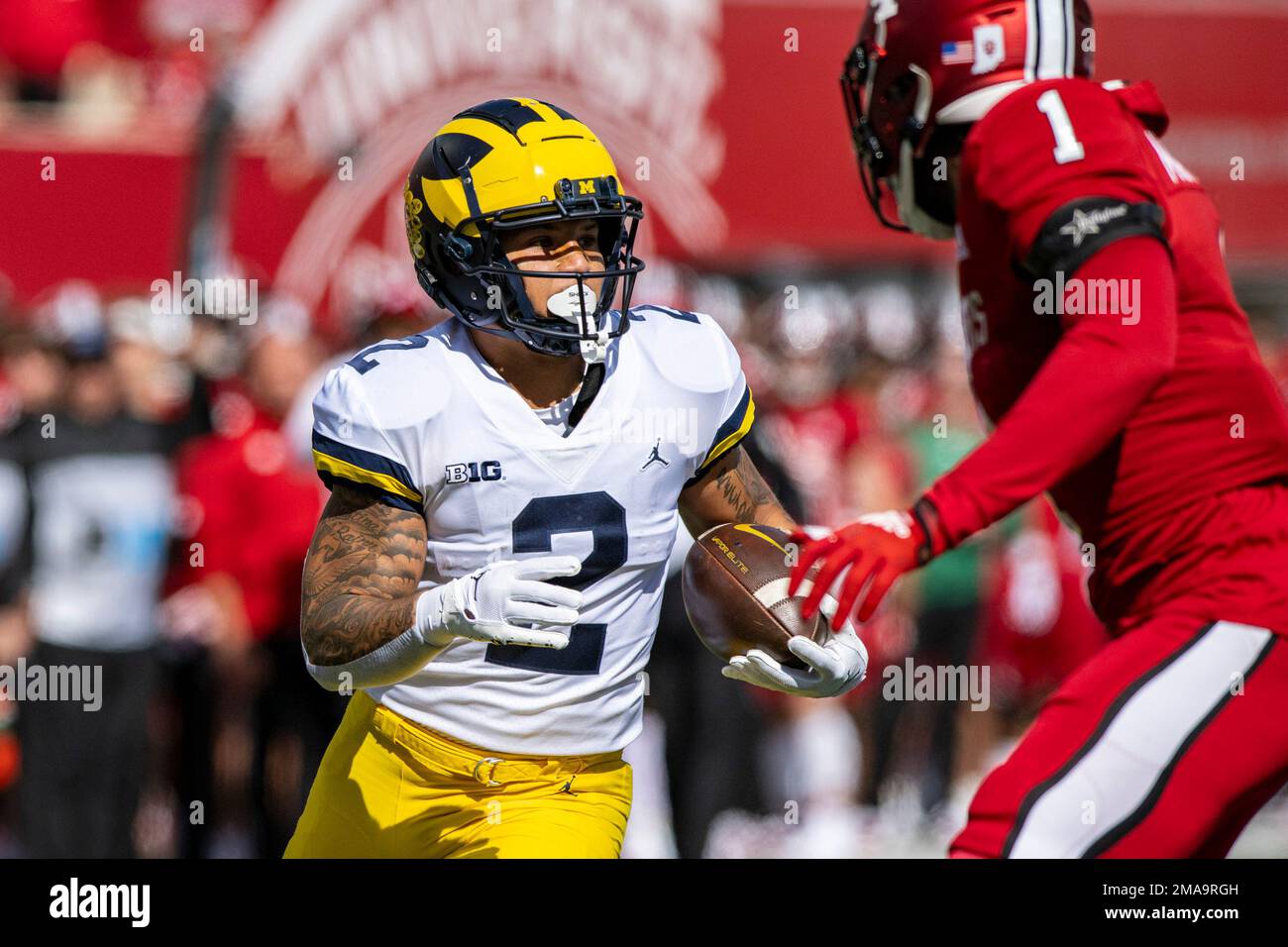Michigan running back Blake Corum (2) runs the ball into the Indiana ...