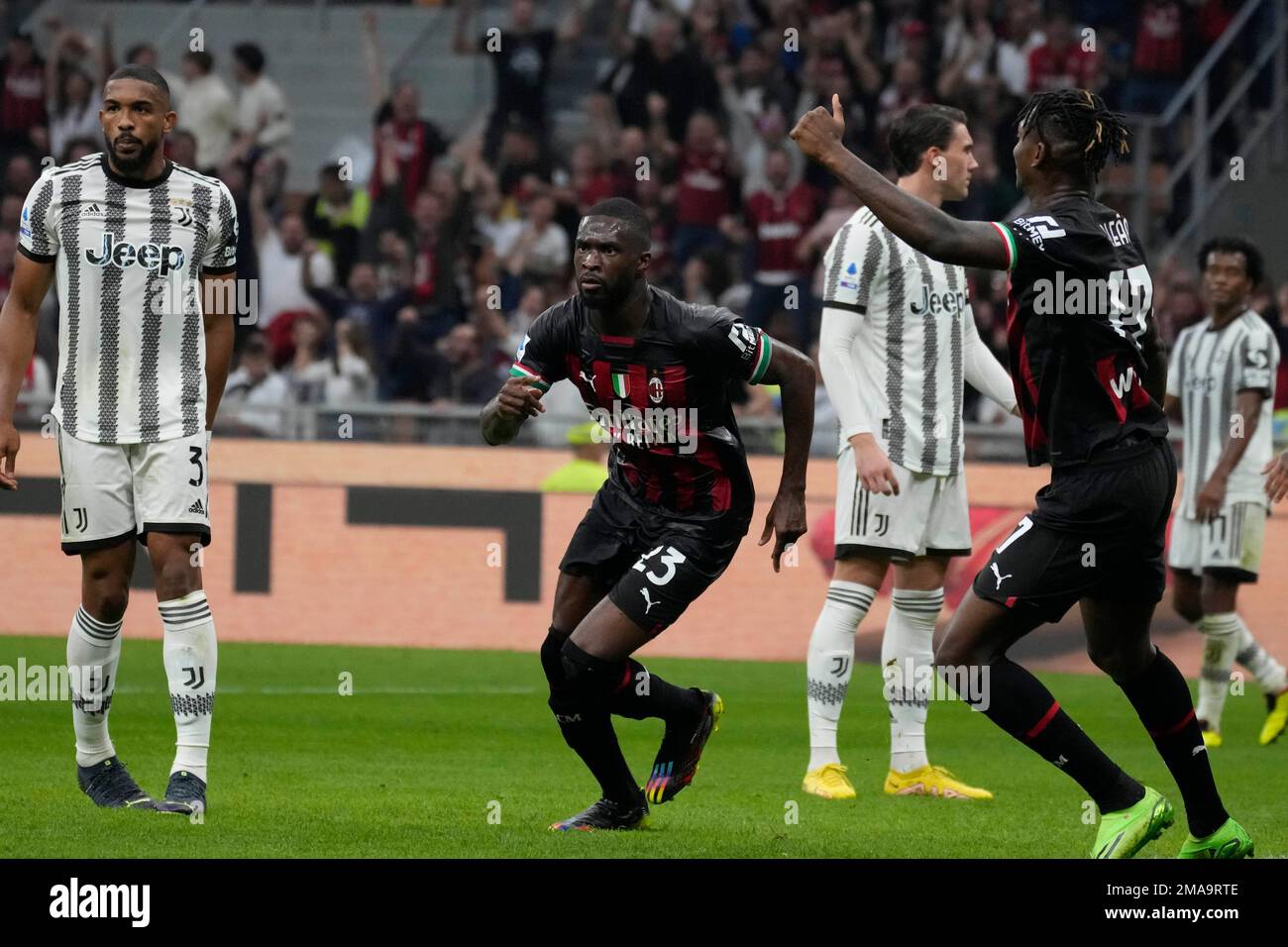AC Milan's Fikayo Tomori, center, celebrates after scoring during the ...