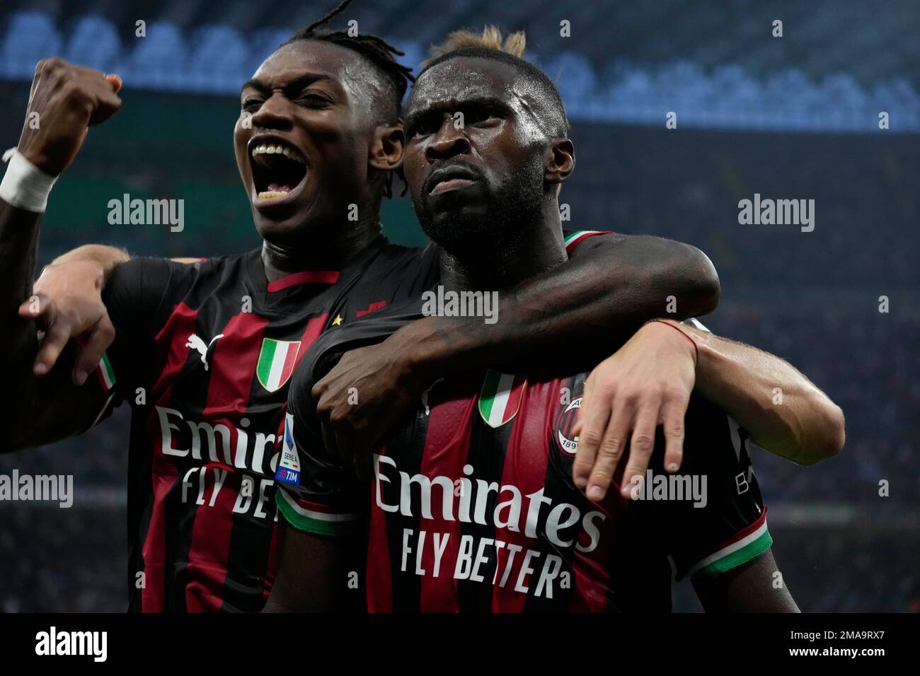 AC Milan's Fikayo Tomori, right, celebrates after scoring during the ...