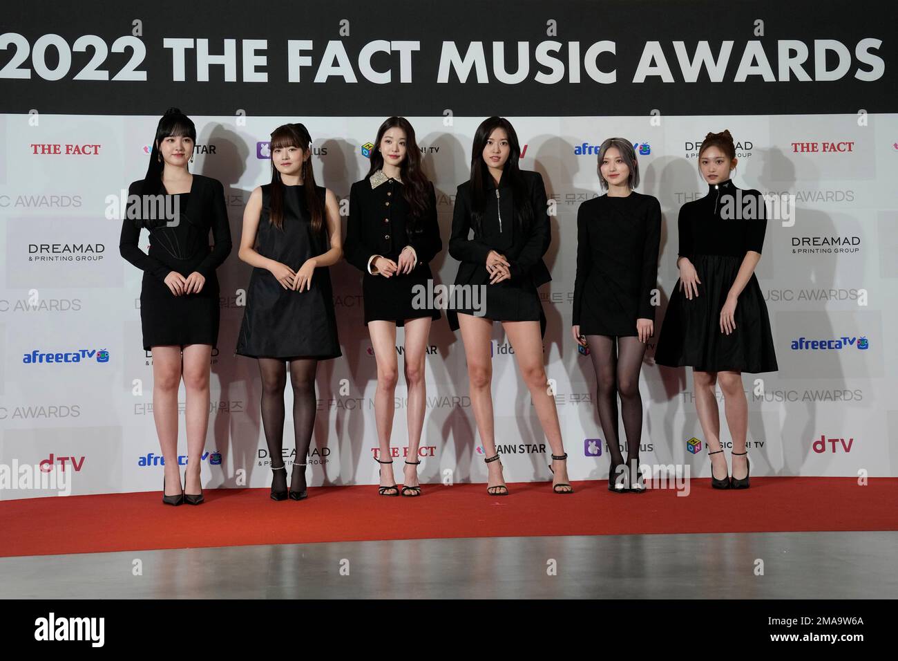 K-Pop girl group IVE pose for photos during the red carpet of 2022 The Fact Music Awards in ...